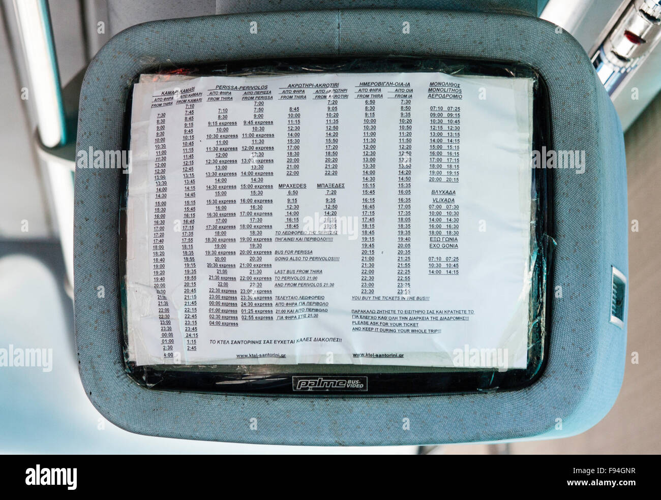 Bus display monitor with paper bus timetable pasted on over the screen ...