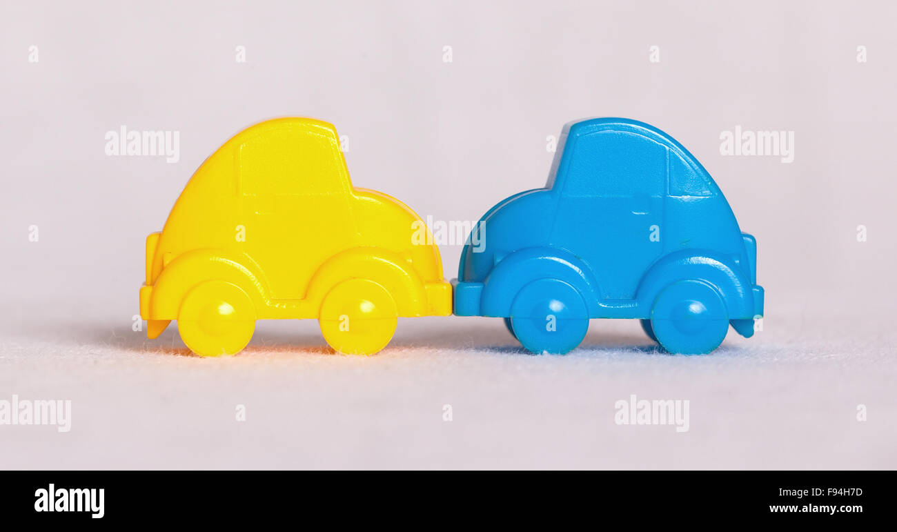 Toy cars in a row isolated on white background, accident Stock Photo ...
