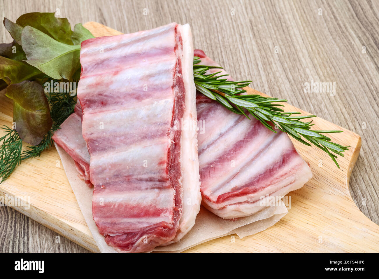 Fresh cold Raw lamb ribs with garlik and pepper - ready for cooking ...