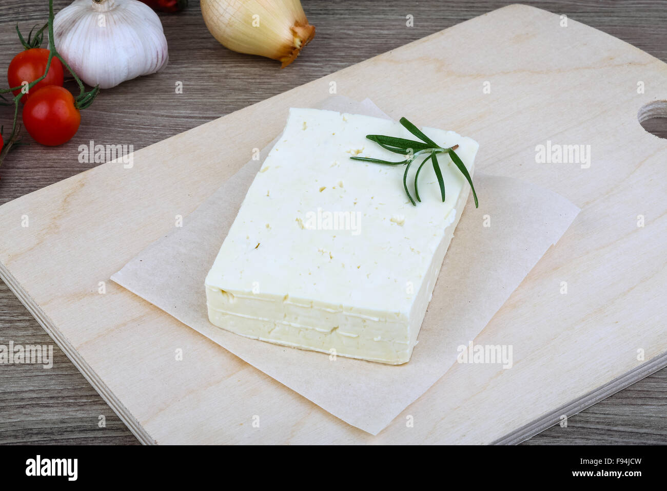 Traditional Caucasian homemade Cheese Brinza with rosemary on wood ...
