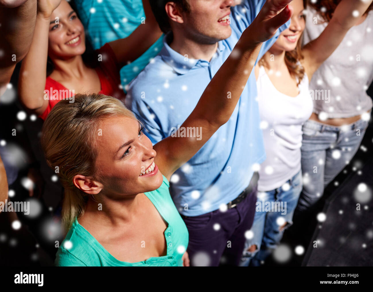 smiling friends at concert in club Stock Photo - Alamy