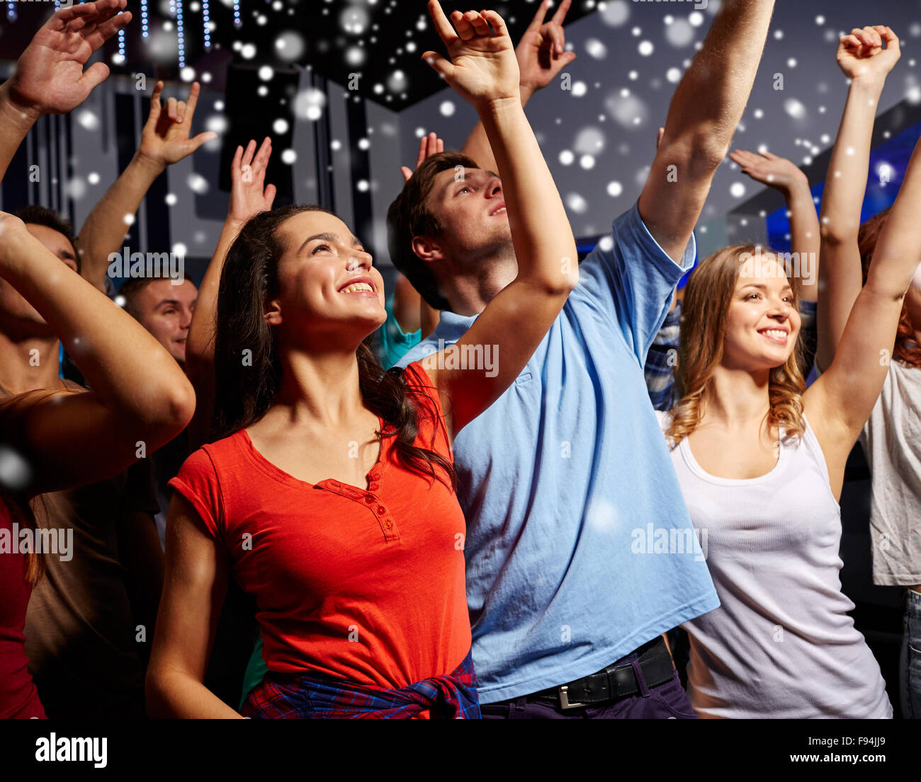 smiling friends at concert in club Stock Photo - Alamy
