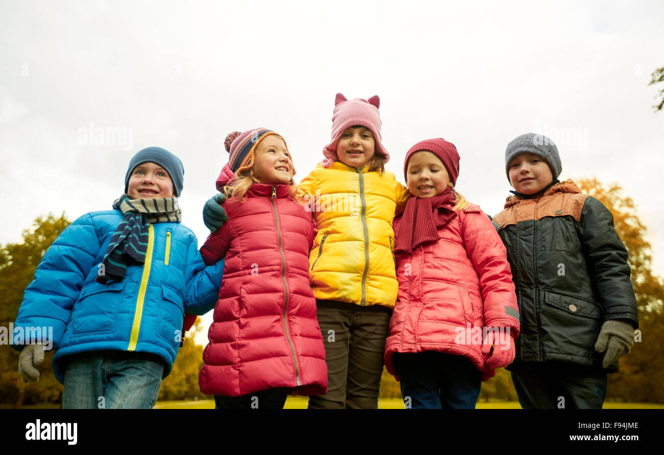 group of happy children hugging in autumn park Stock Photo - Alamy