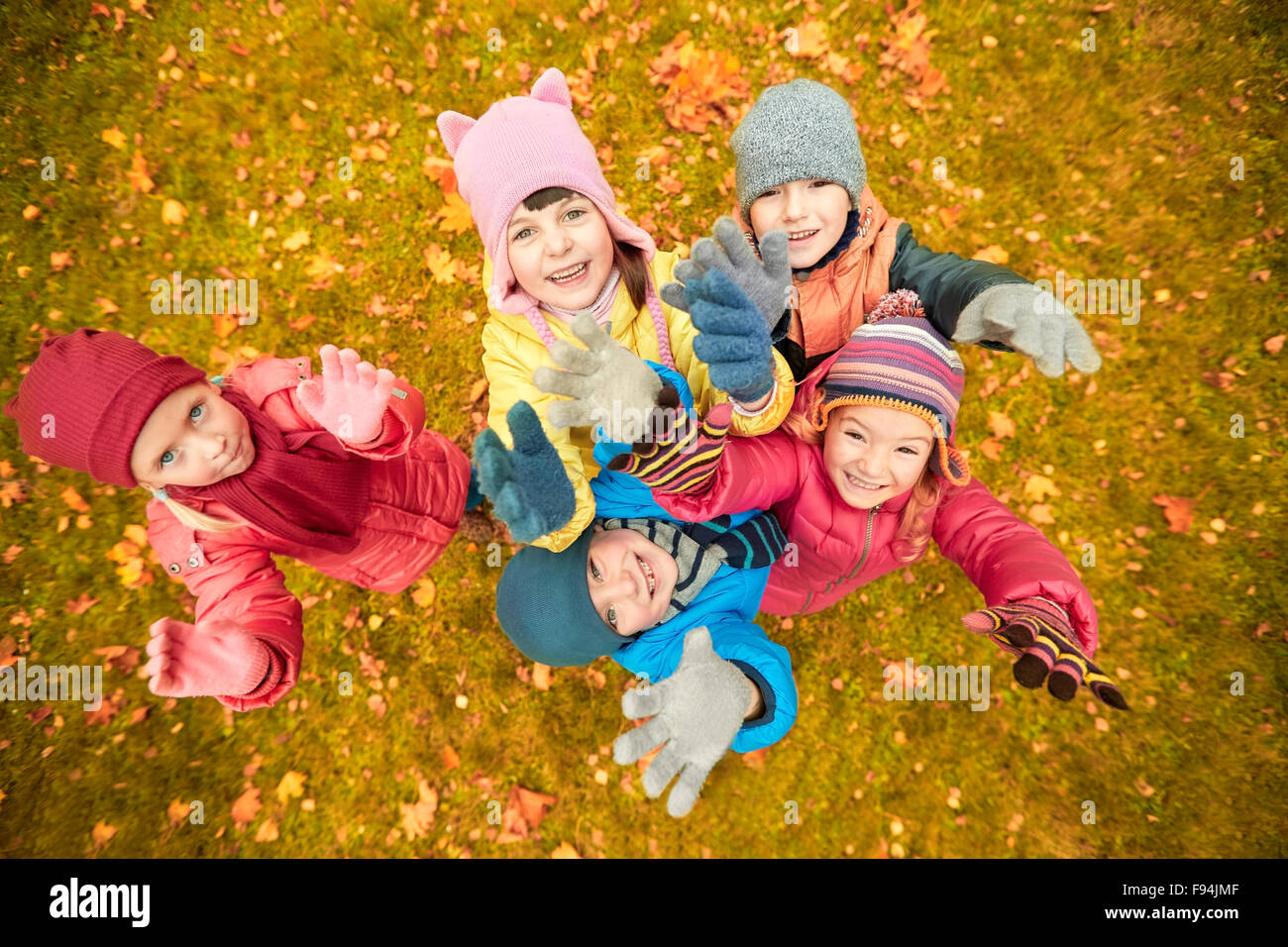 happy children waving hands in autumn park Stock Photo - Alamy