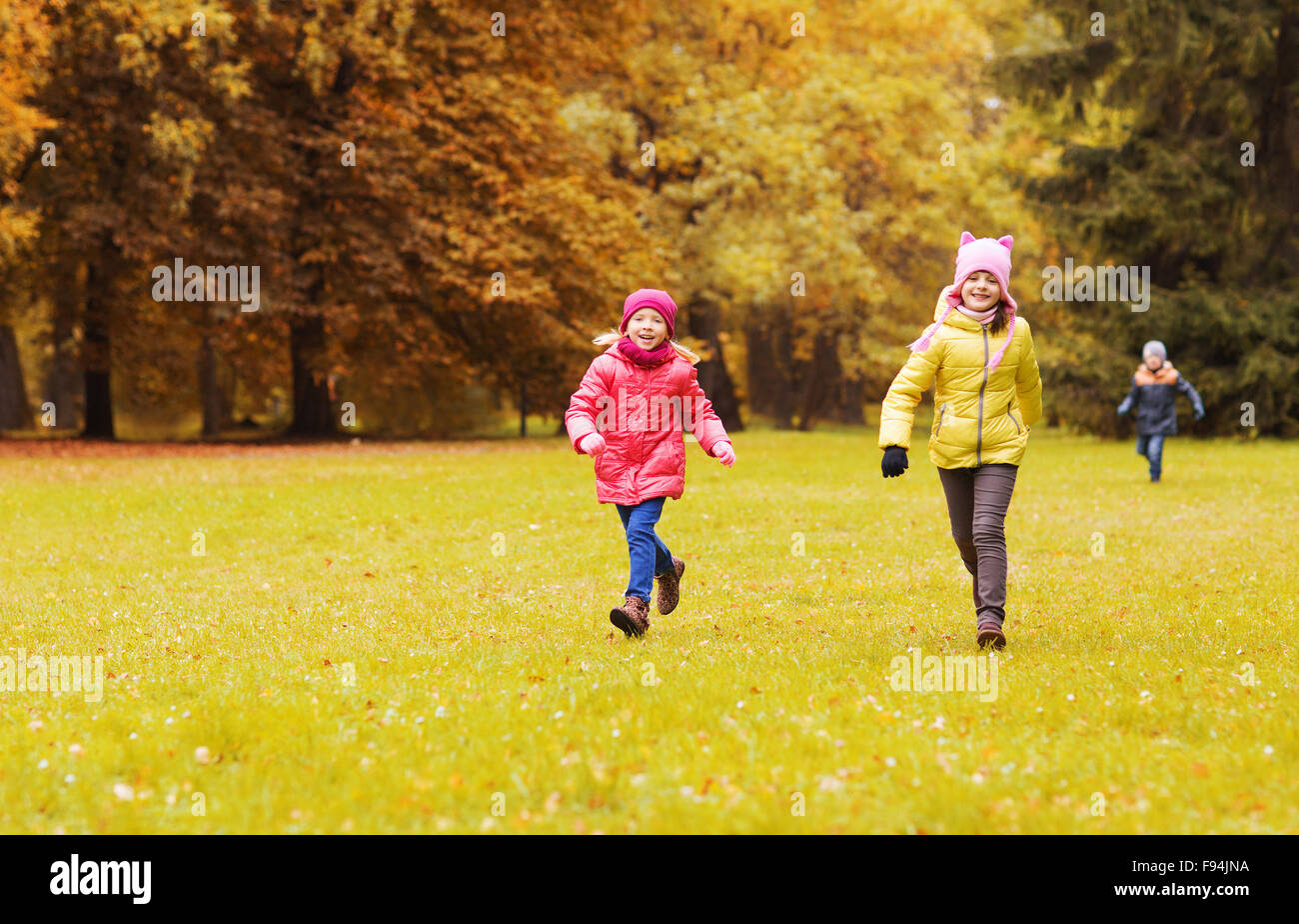 group of happy little kids running outdoors Stock Photo - Alamy