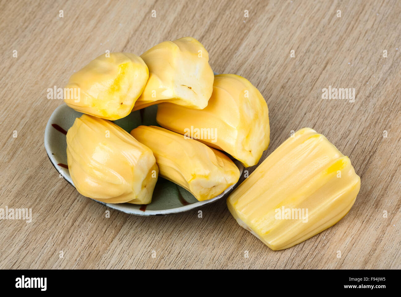 Tropical Jack Fruit on the wood background Stock Photo - Alamy
