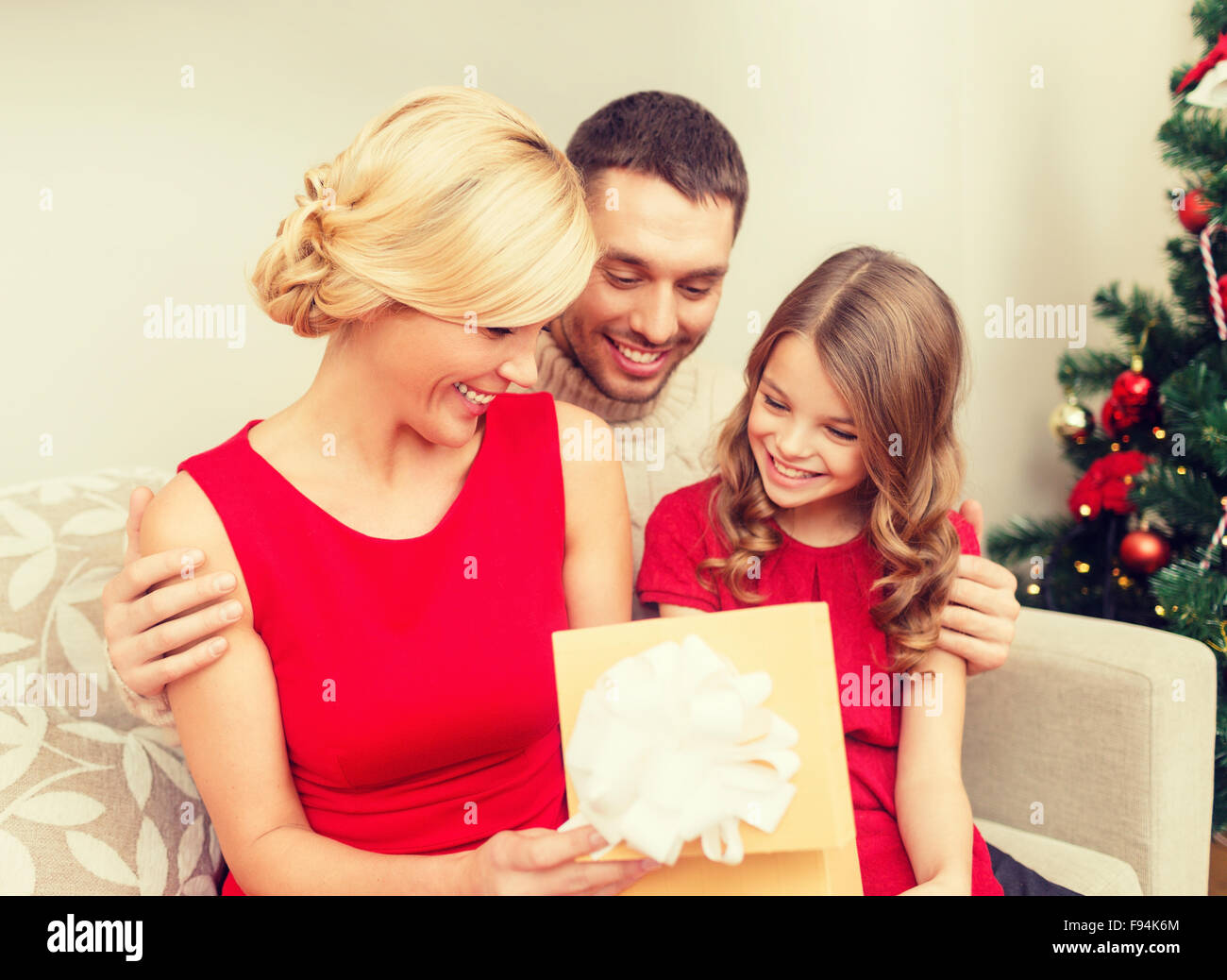 happy family opening gift box Stock Photo - Alamy