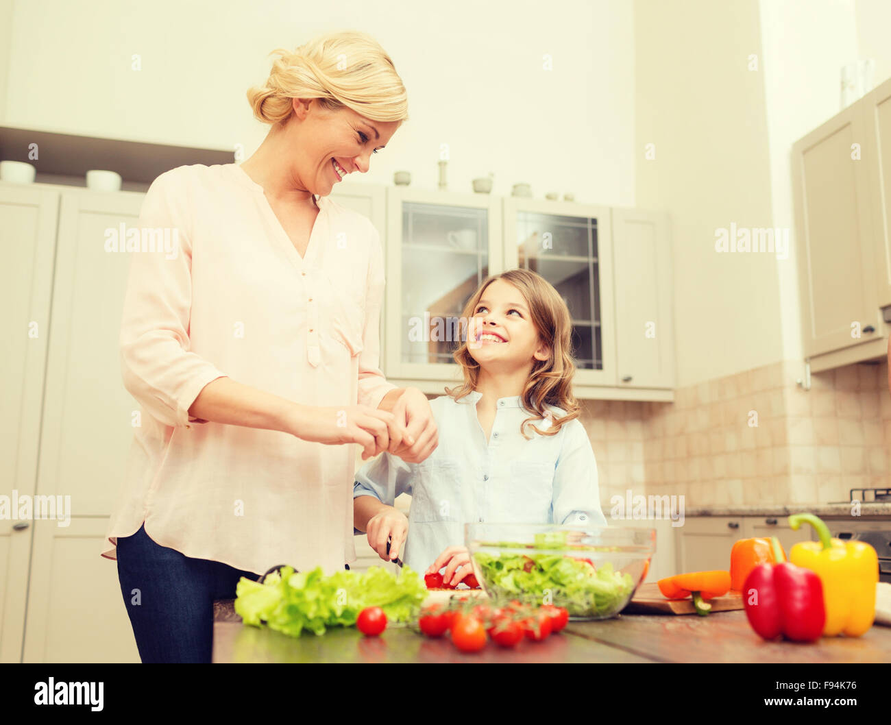 happy family making dinner in kitchen Stock Photo - Alamy