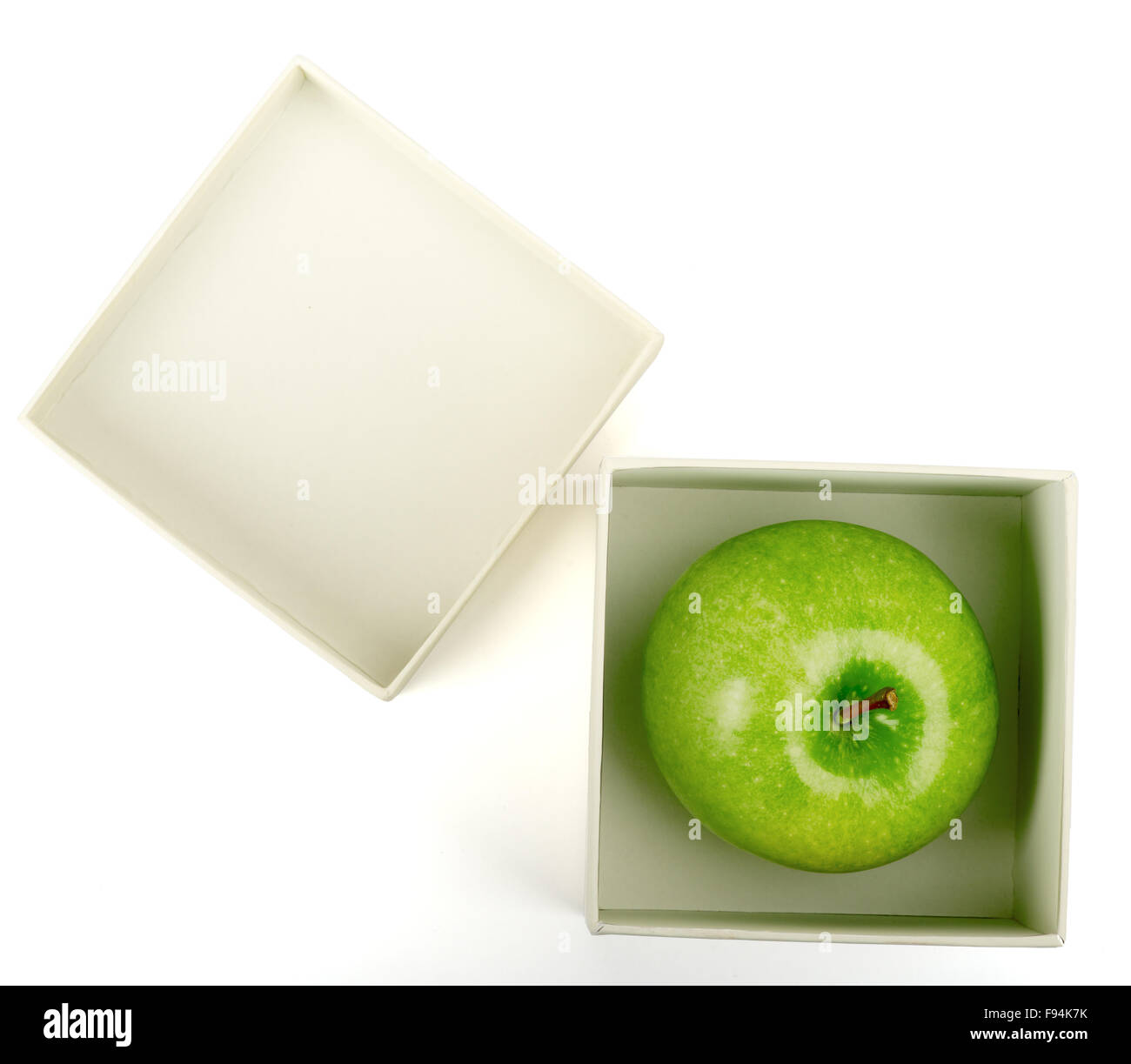 Apple in white box Stock Photo - Alamy