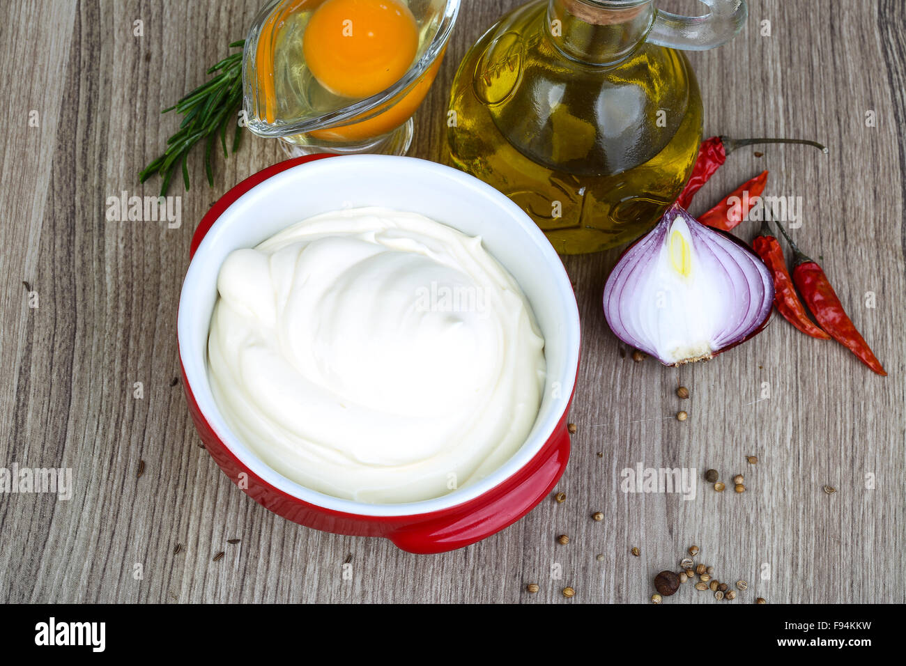 Mayonnaise sauce served raw egg, olive oil and rosemary Stock Photo - Alamy