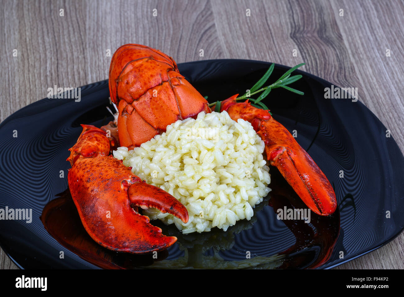 Delicous Risotto with lobster served rosemary and parmesan Stock Photo ...