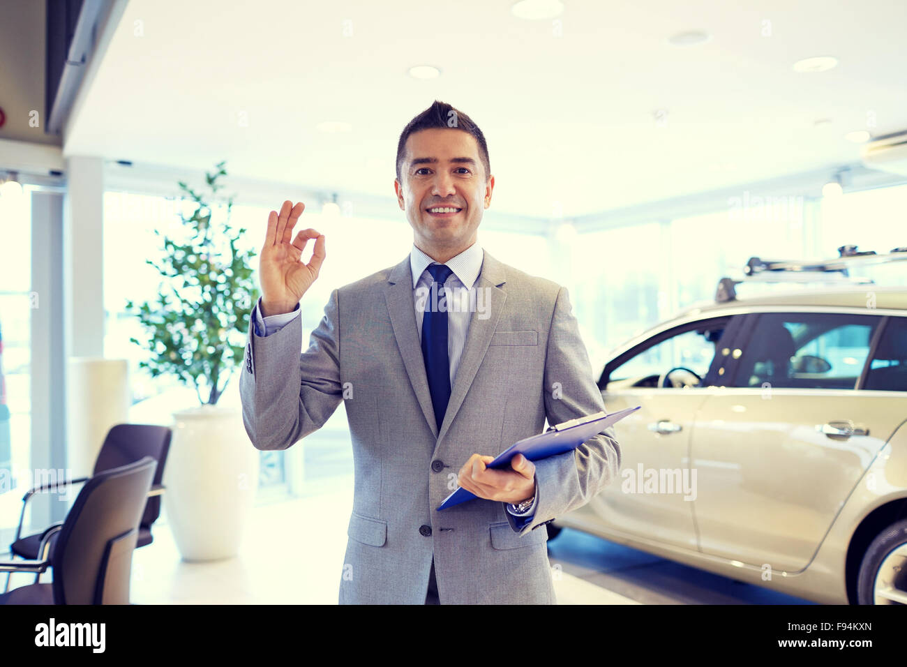 happy man at auto show or car salon Stock Photo - Alamy