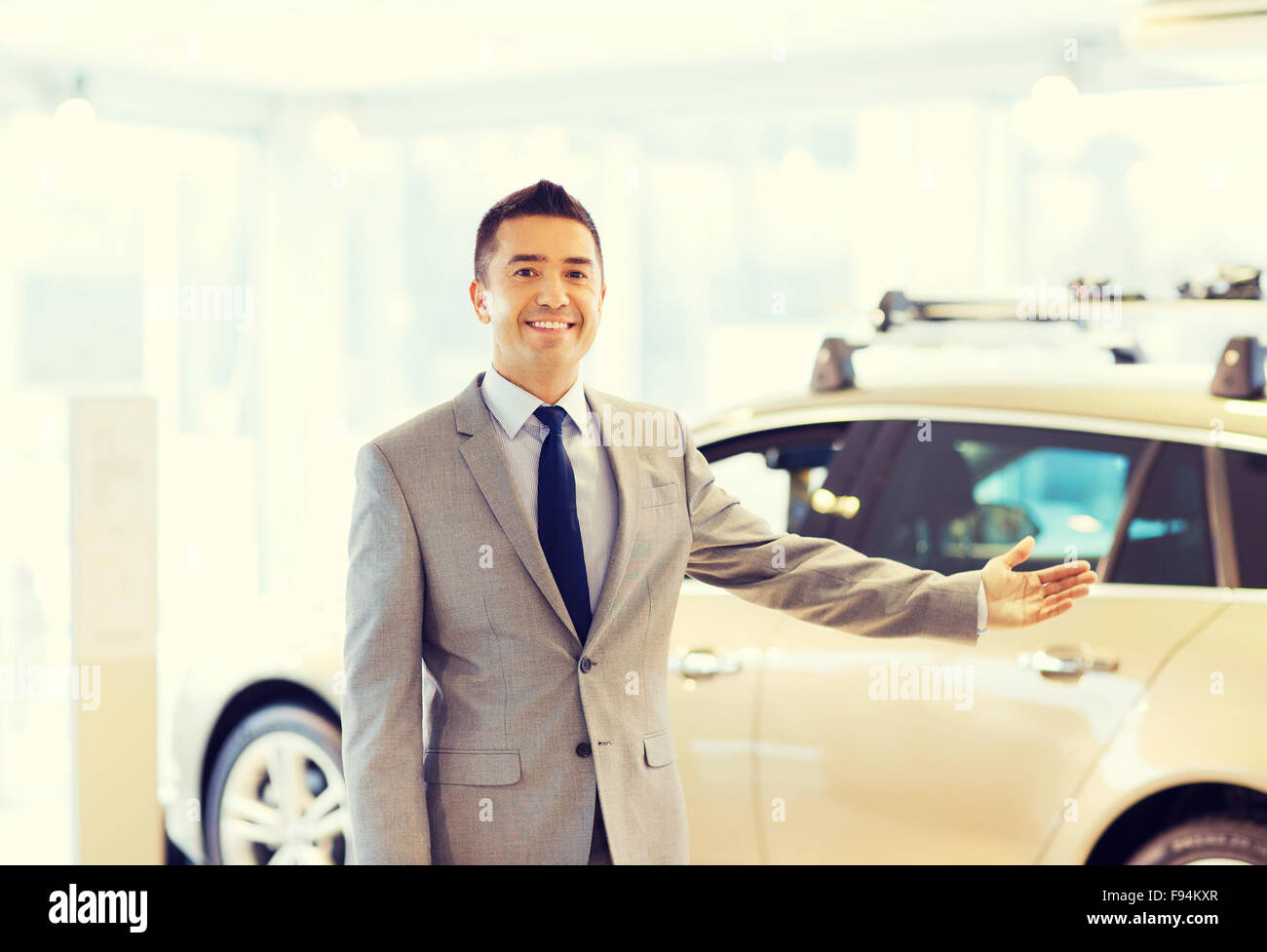 happy man at auto show or car salon Stock Photo - Alamy