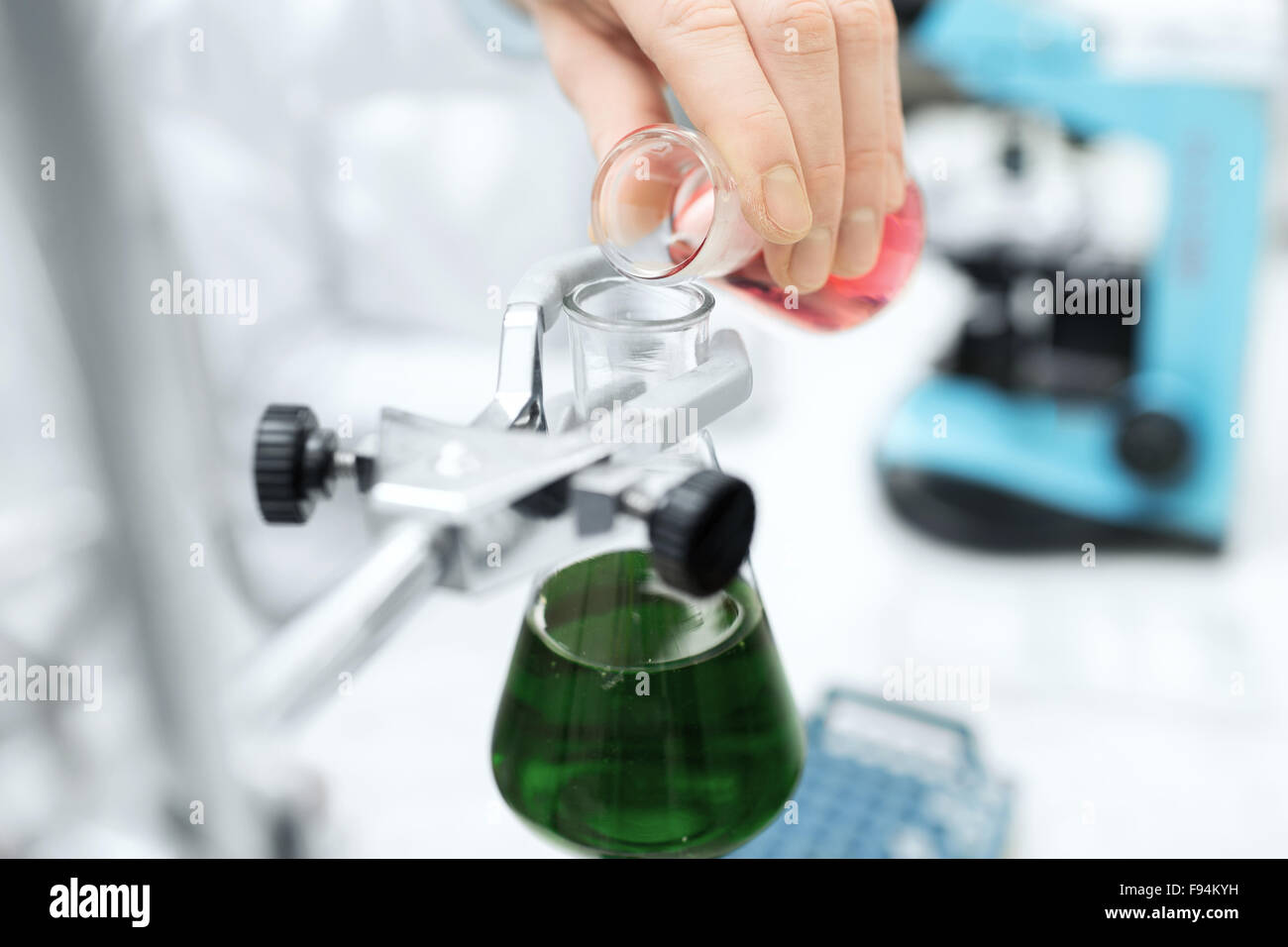 close up of scientist filling test tubes in lab Stock Photo - Alamy