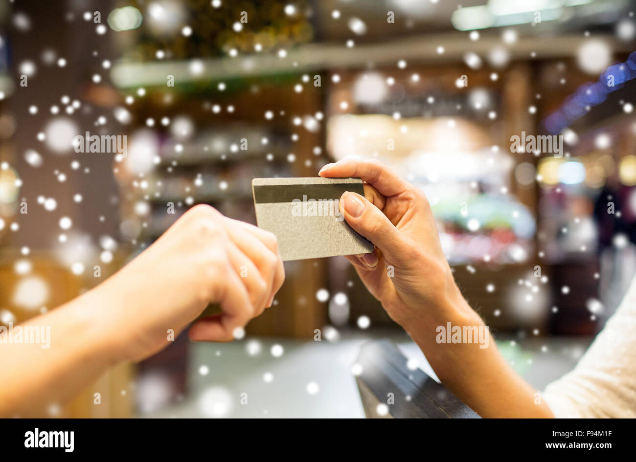 close up of hands giving credit card in mall Stock Photo - Alamy
