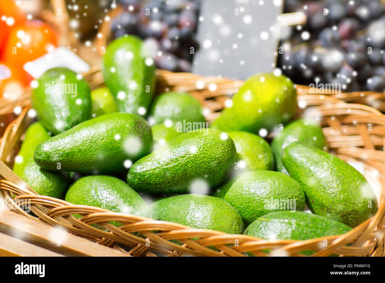 avocado in basket at food market Stock Photo - Alamy