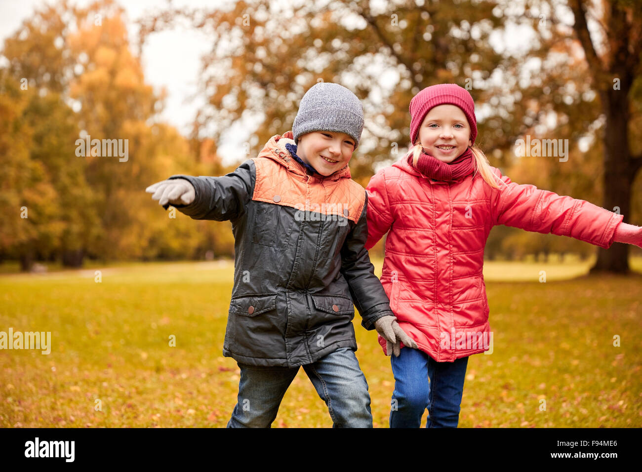happy little children running and playing outdoors Stock Photo - Alamy