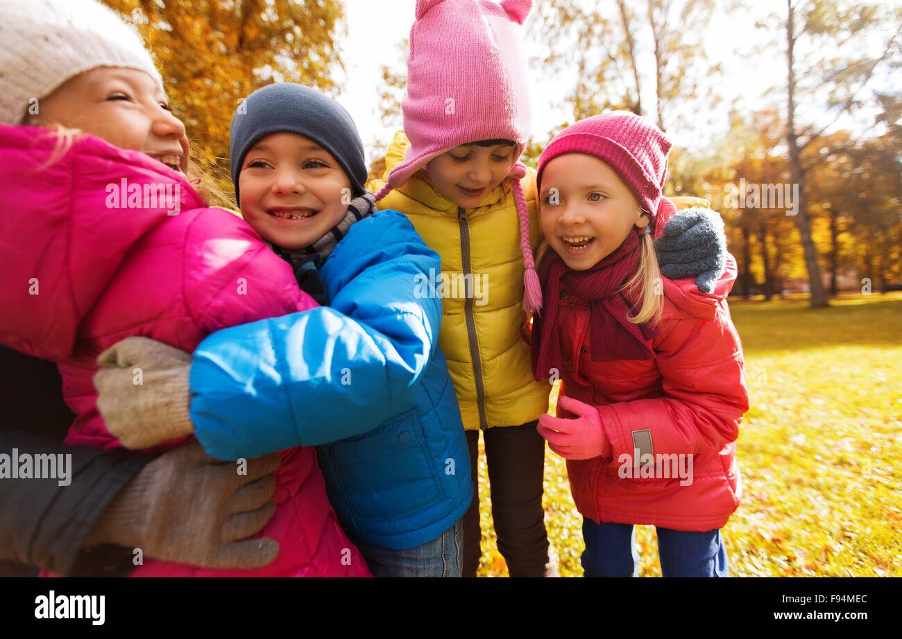 group of happy children hugging in autumn park Stock Photo - Alamy