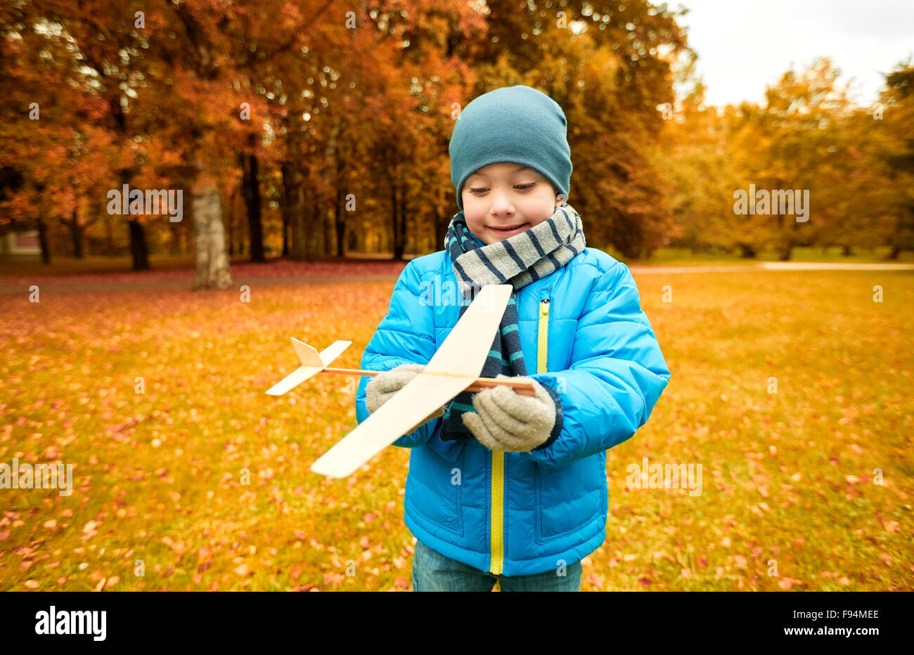 happy little boy playing with toy plane outdoors Stock Photo - Alamy