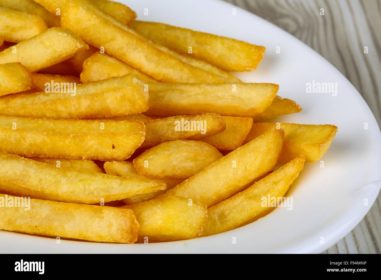 Hot fresh French fries snack in the plate Stock Photo - Alamy