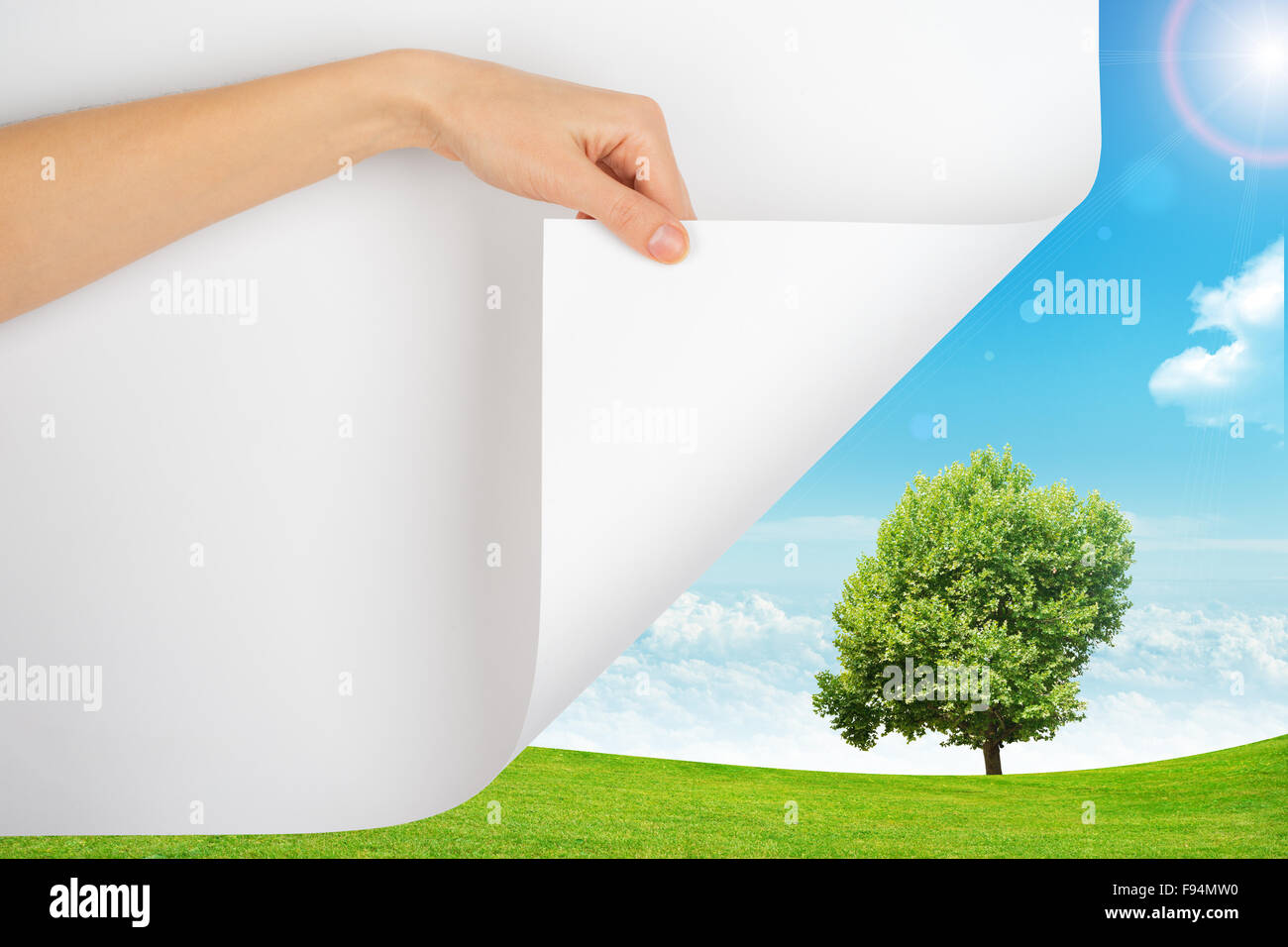 Hand turning page Stock Photo - Alamy