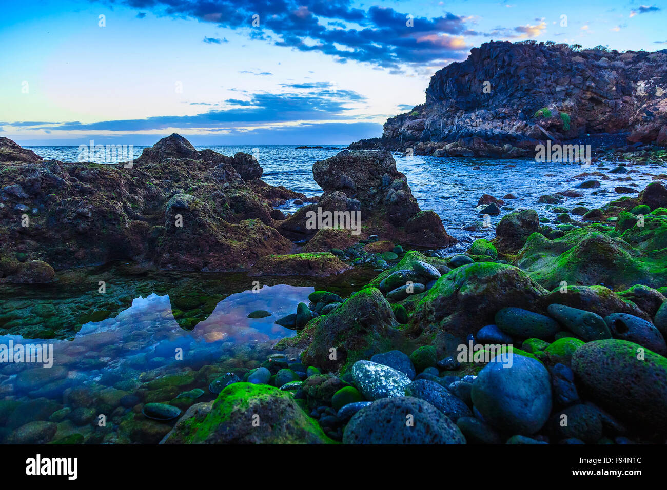 Stone Coast or Shore of Atlantic Ocean with Sky Reflection in water on ...