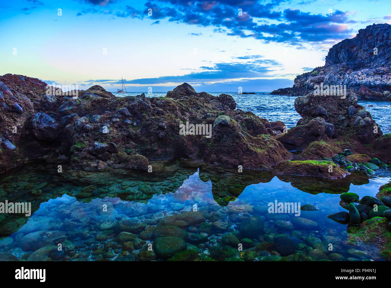 Stone Coast or Shore of Atlantic Ocean with Sky Reflection in water on ...