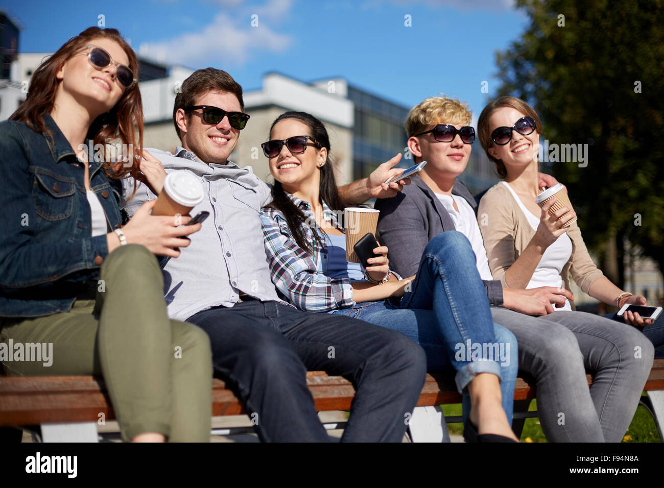 group of students or teenagers drinking coffee Stock Photo - Alamy