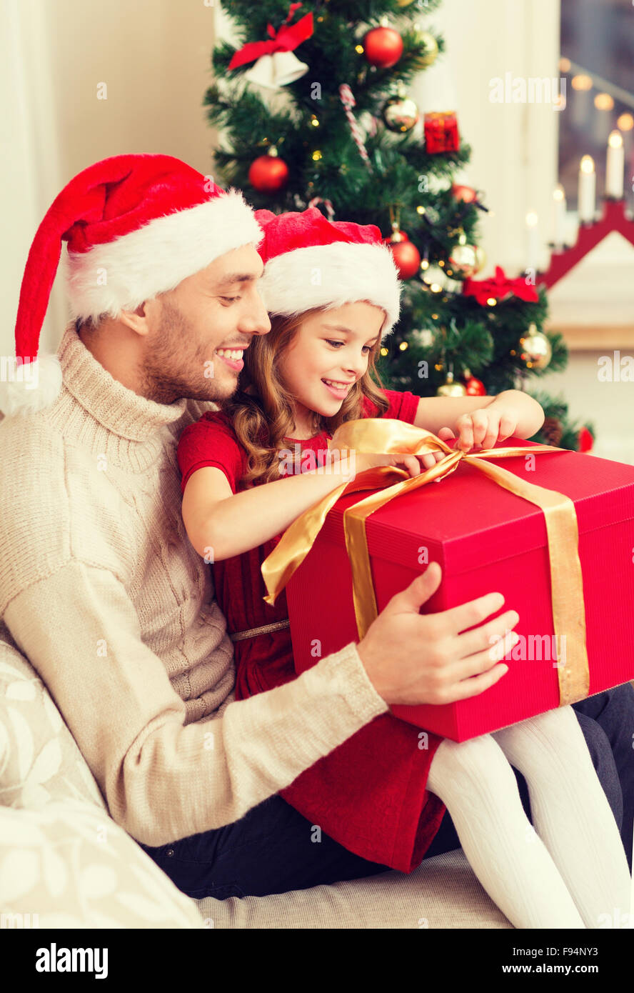 smiling father and daughter opening gift box Stock Photo - Alamy