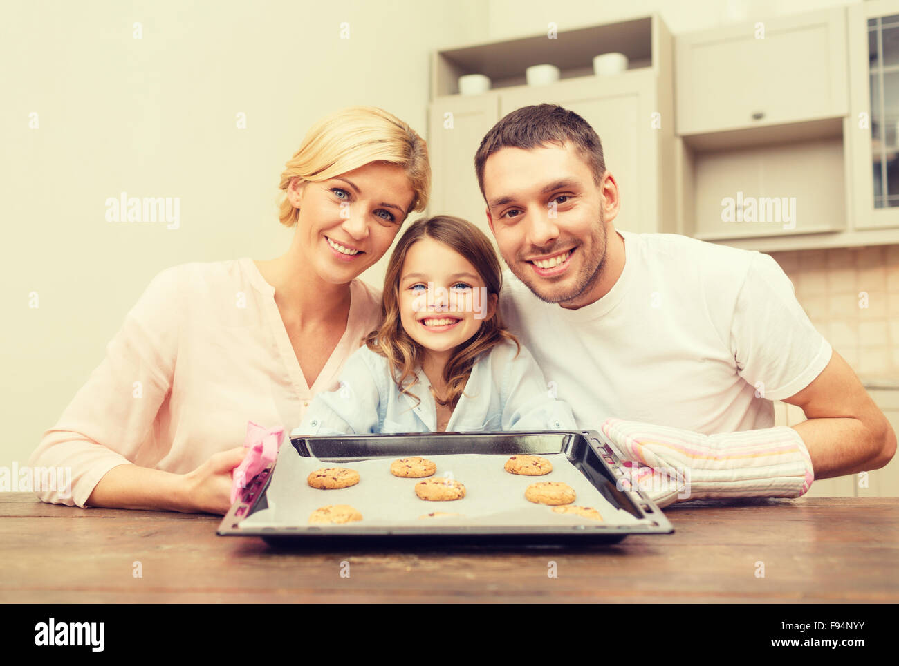 happy family making cookies at home Stock Photo - Alamy
