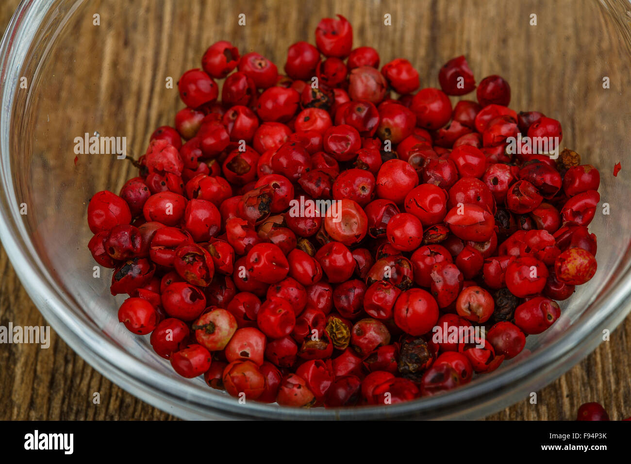 Dry Rose pepper corn on the wood background Stock Photo - Alamy