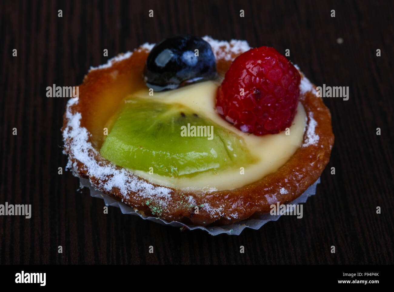 Sweet Pastry with berries on the wood background Stock Photo - Alamy