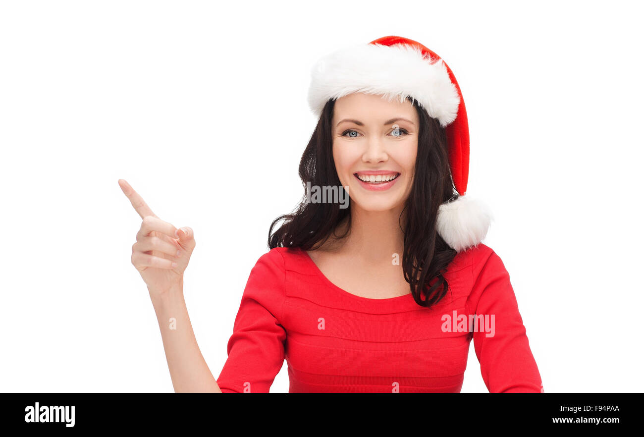 woman in santa helper hat pointing to something Stock Photo - Alamy