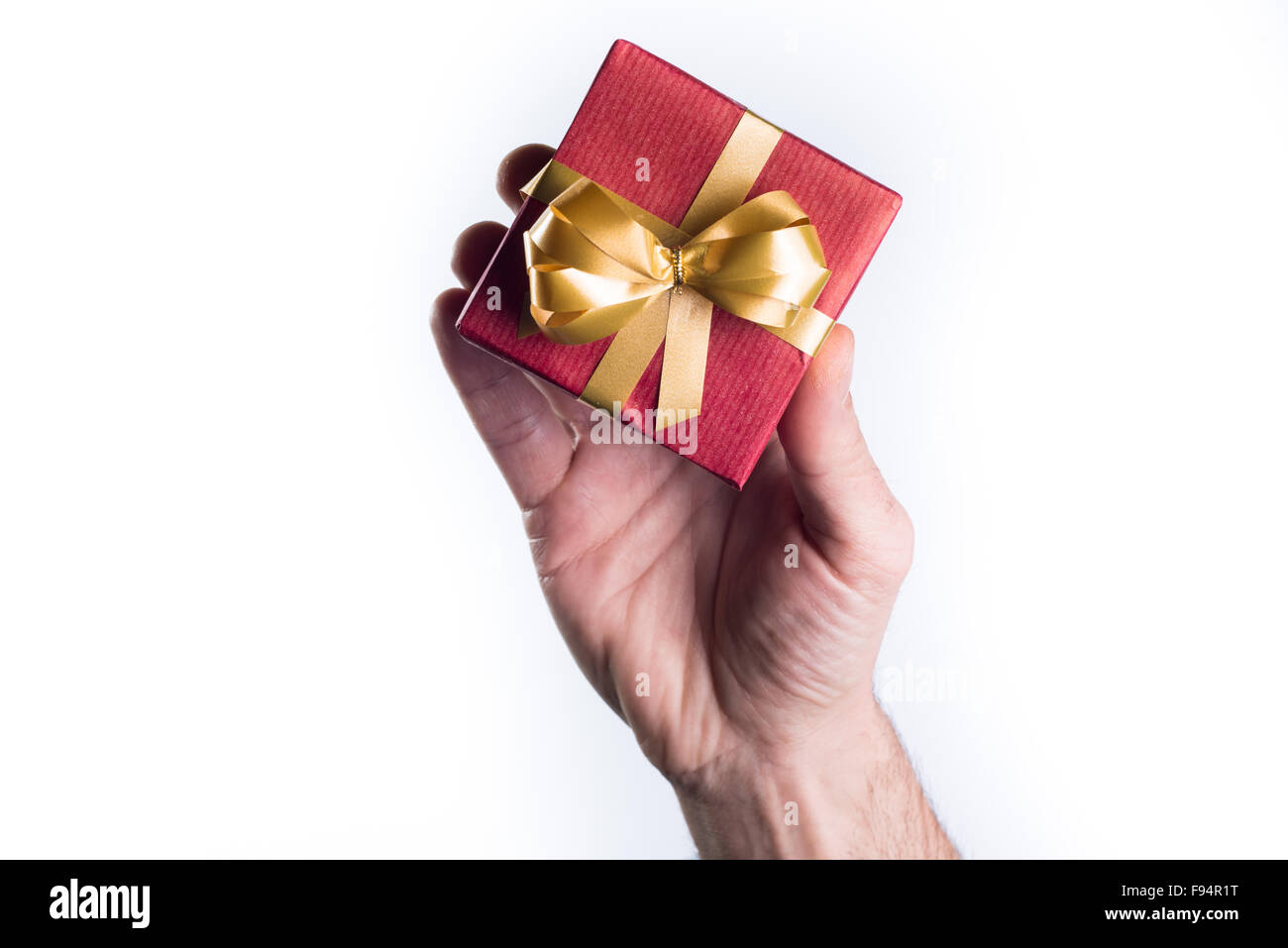 Concept hands giving gift on white background Stock Photo - Alamy