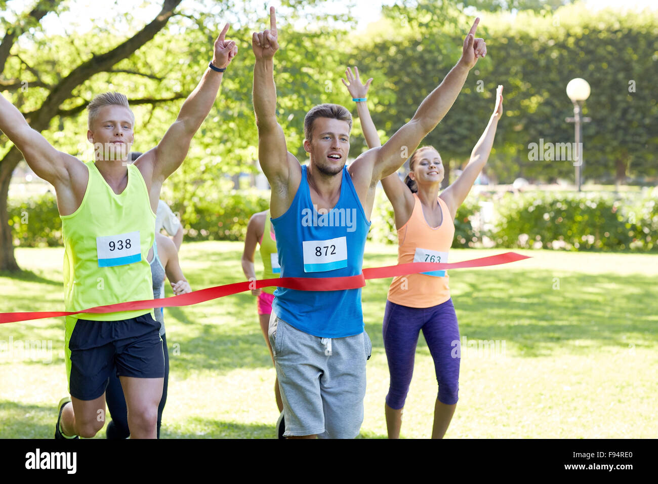 happy young male runner winning on race finish Stock Photo - Alamy