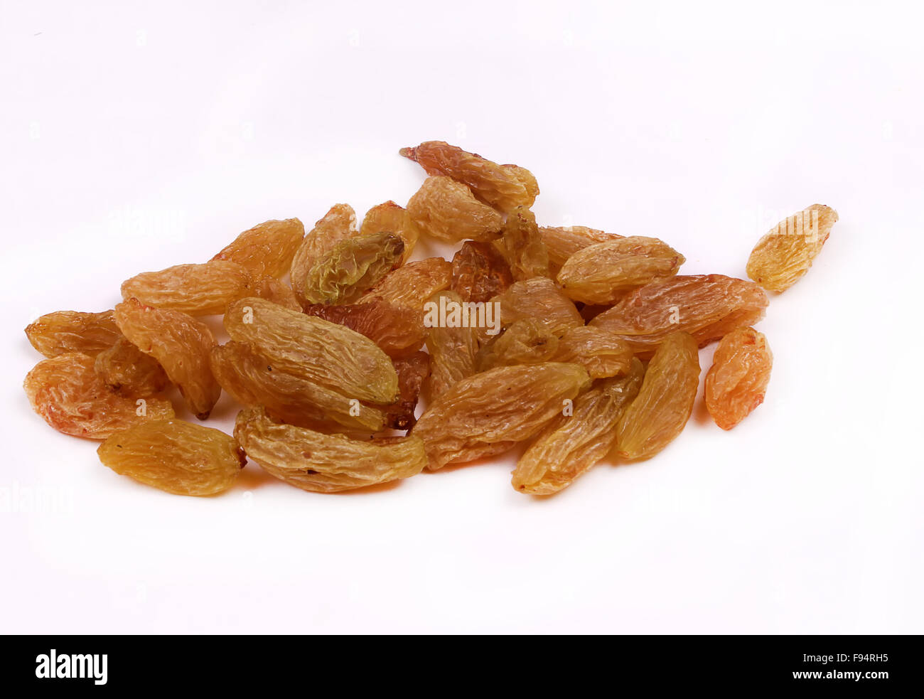 Yellow sultanas raisins isolated on white background Stock Photo - Alamy