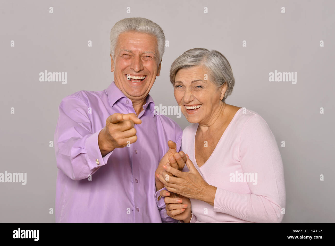Elderly couple pointing Stock Photo - Alamy