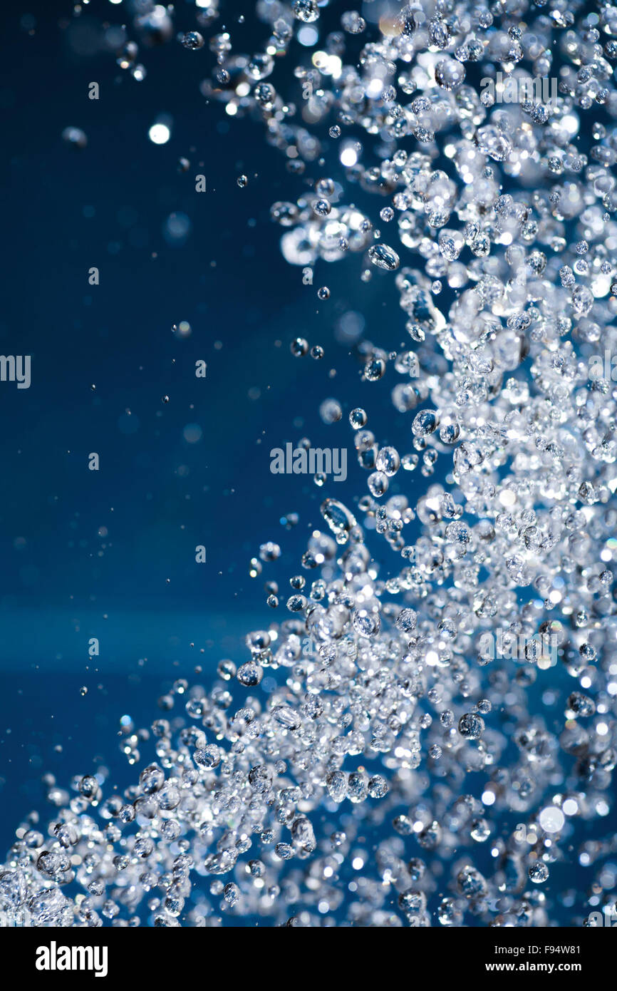 Bended blue splash of waterdrops close up shoot Stock Photo - Alamy