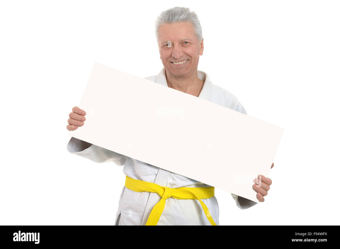 Karate Senior man with poster Stock Photo - Alamy