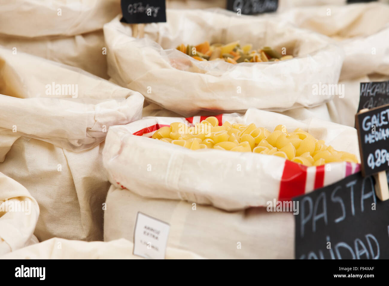 varied pasta in bags on the market Stock Photo - Alamy