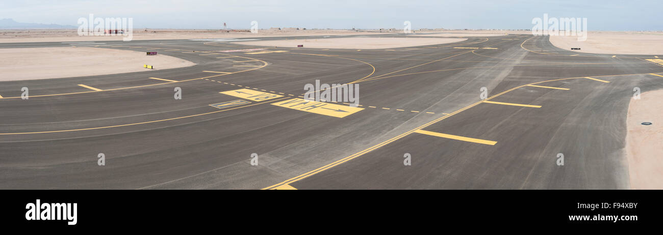 Aerial panoramic view of a commercial airport runway with connections ...