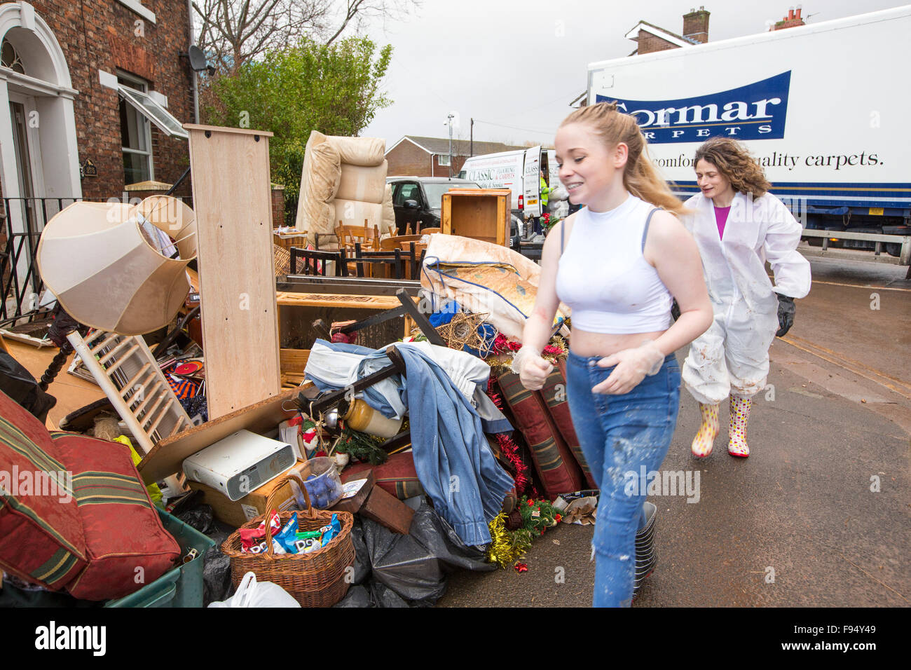 Jenny Kay removes flood damaged property from her house on Warwick Road ...