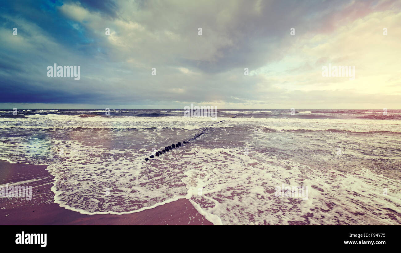 Vintage toned stormy sky over rough sea, calm before the storm concept ...