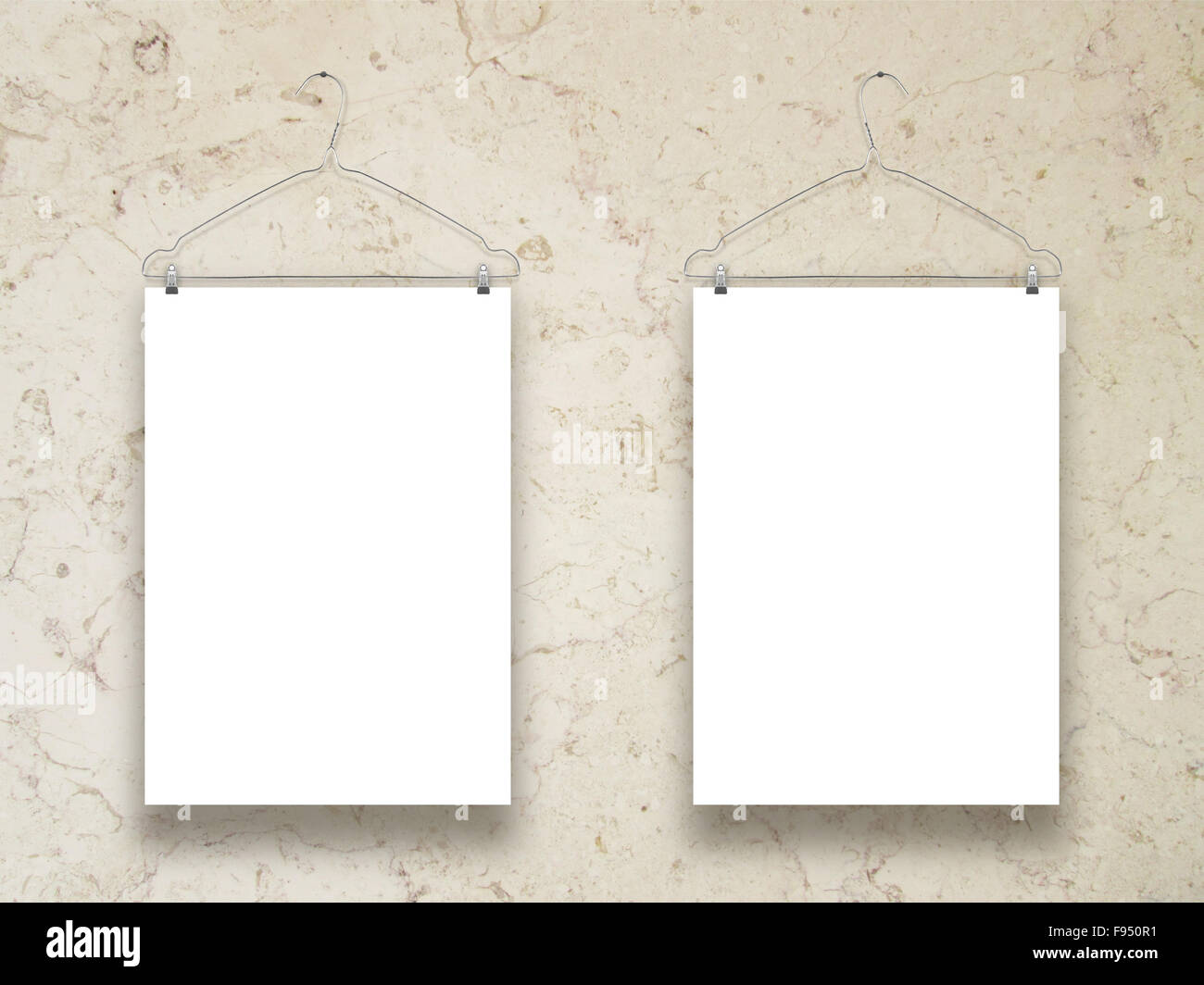 Two hanged paper sheets with metal hanger on marble background Stock ...