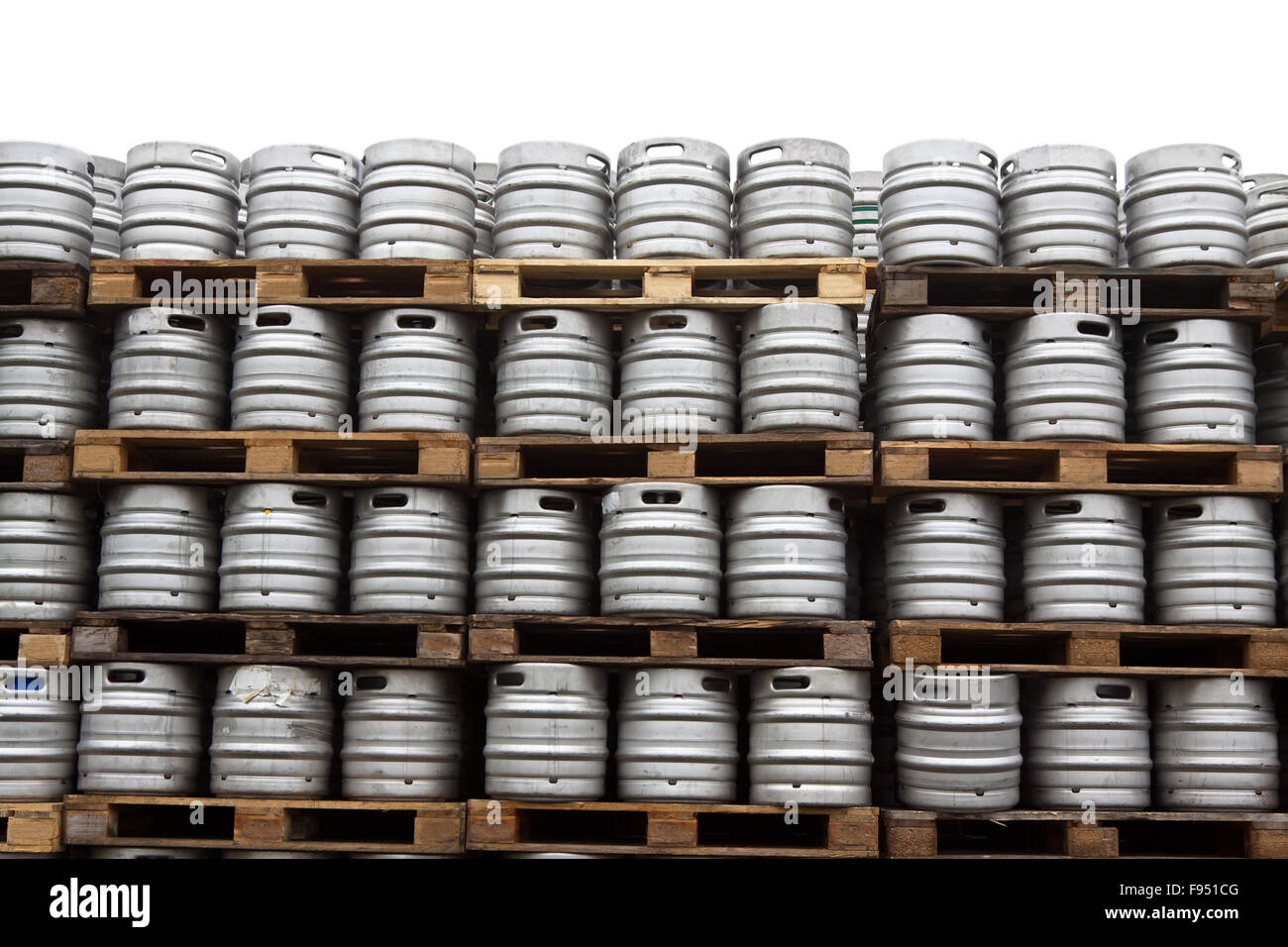 Beer kegs in rows over white background Stock Photo - Alamy
