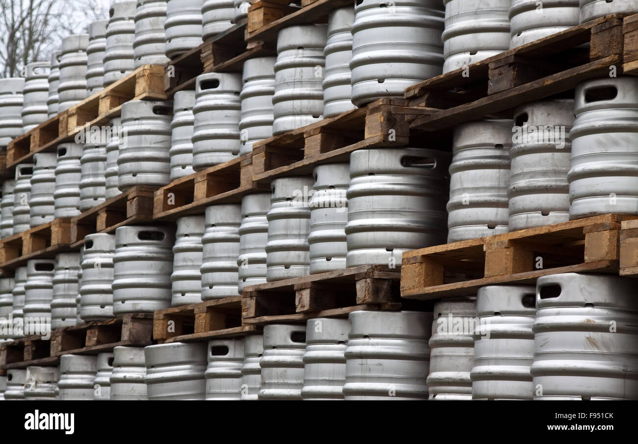 Many metal kegs of beer in regular rows Stock Photo - Alamy