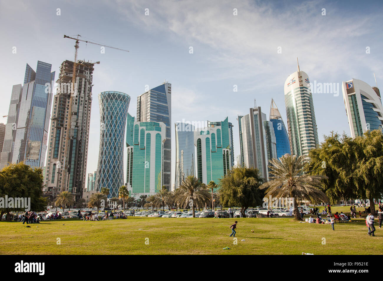 Doha city seen from the park with some kids playing Stock Photo - Alamy