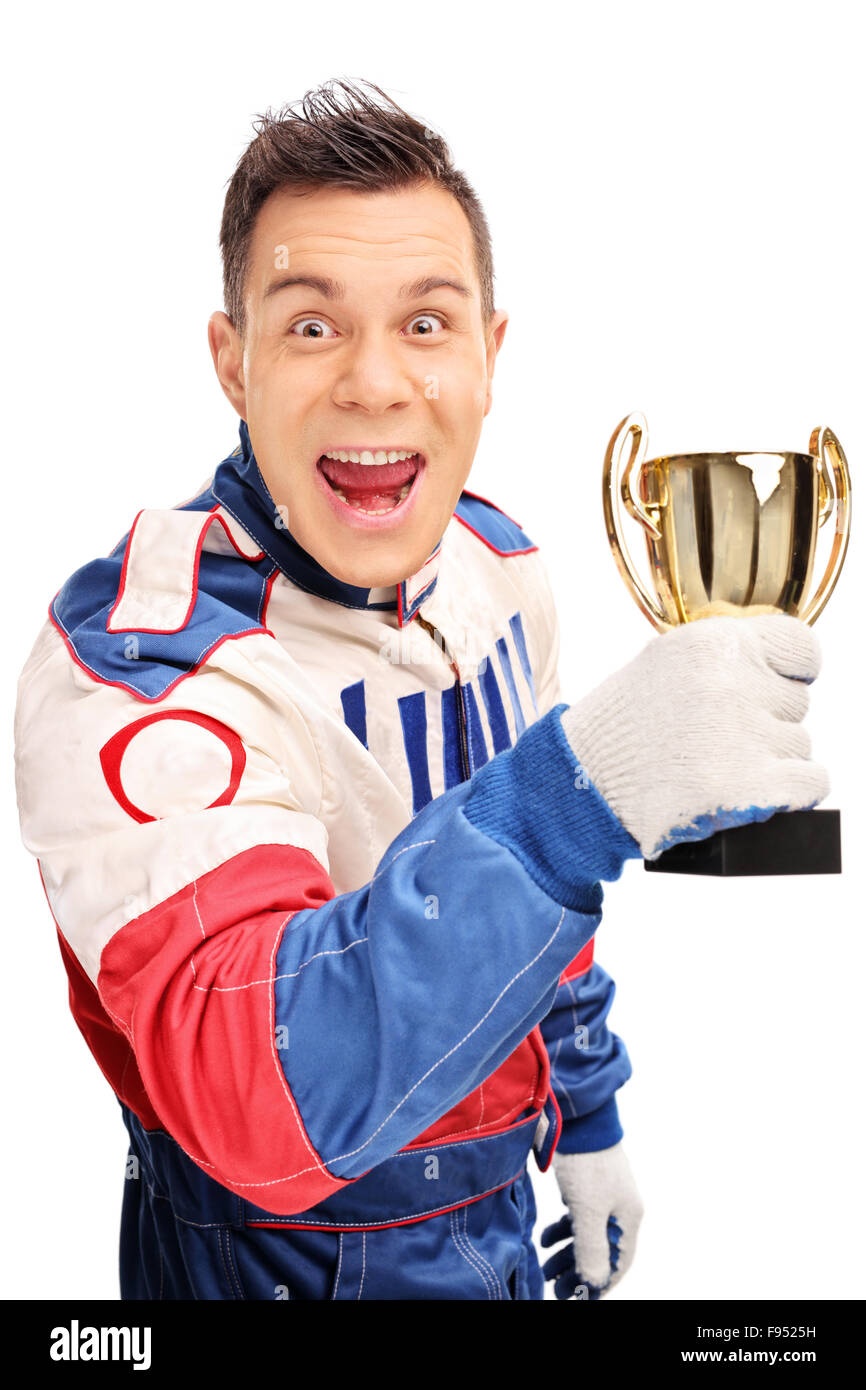 Vertical shot of a delighted car racer holding a gold trophy and ...