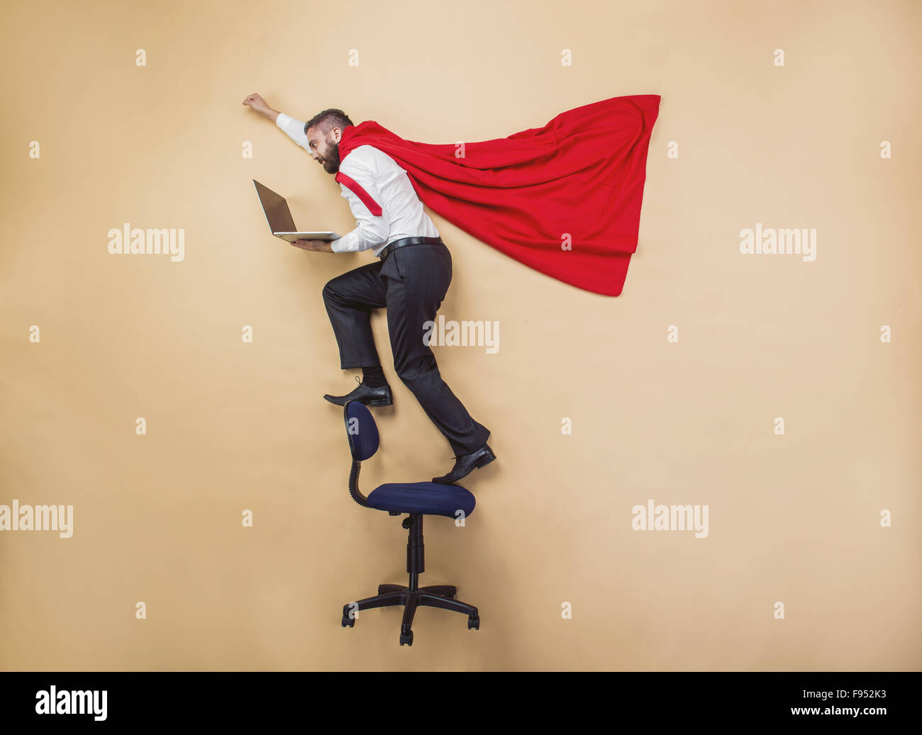 Manager with coat of superman. Superhero in studio Stock Photo - Alamy