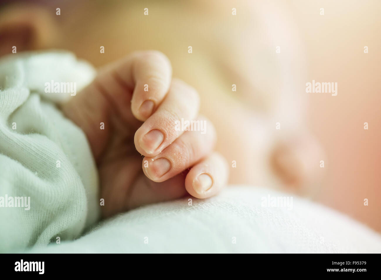 Detail of newborn baby girl’s hand sleeping Stock Photo - Alamy